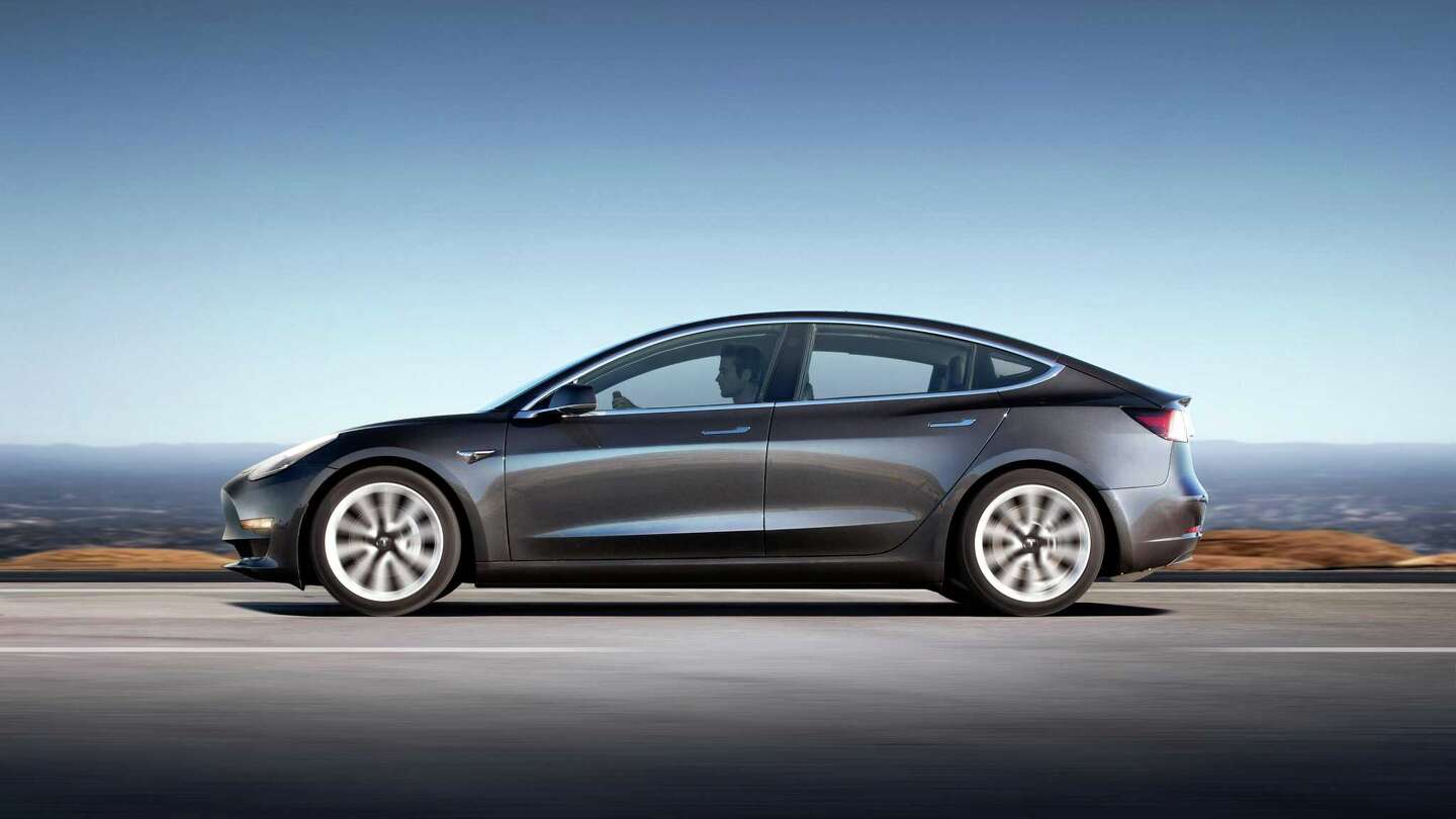 Elon Musk hands over the 1st Tesla Model 3s, and reveals its secrets