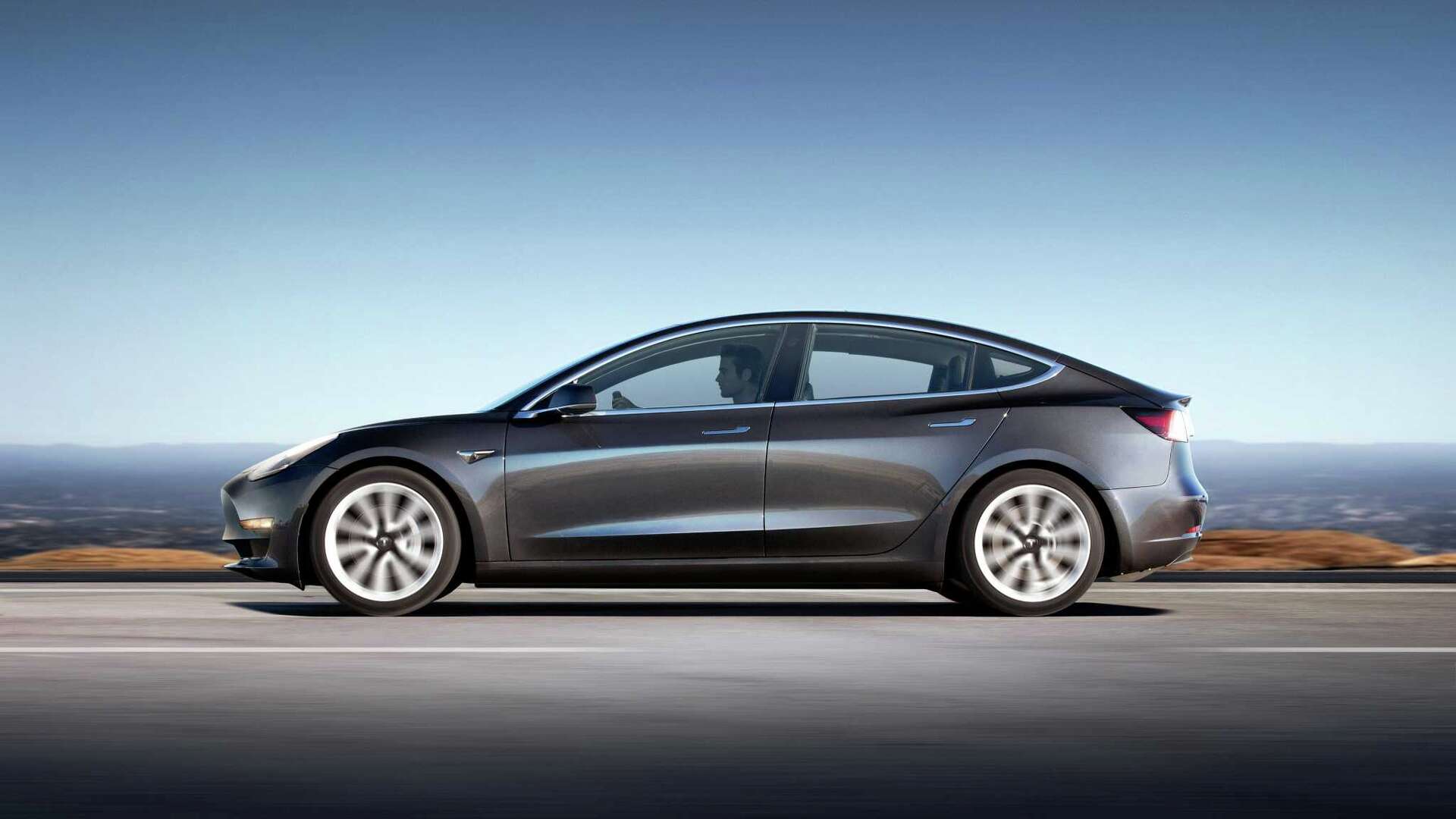 Elon Musk hands over the 1st Tesla Model 3s, and reveals its secrets