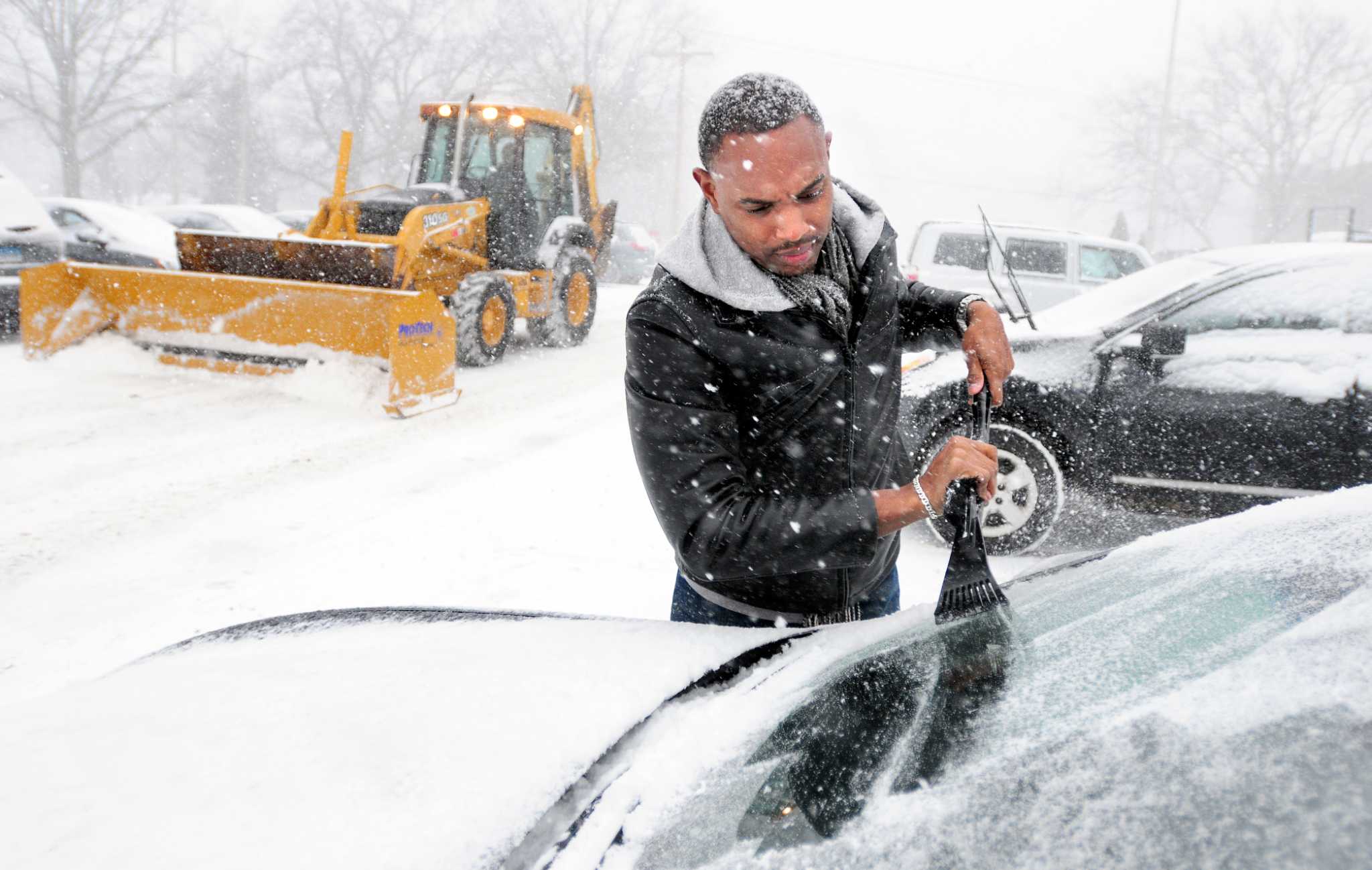 Photos: Snow snarls evening commute