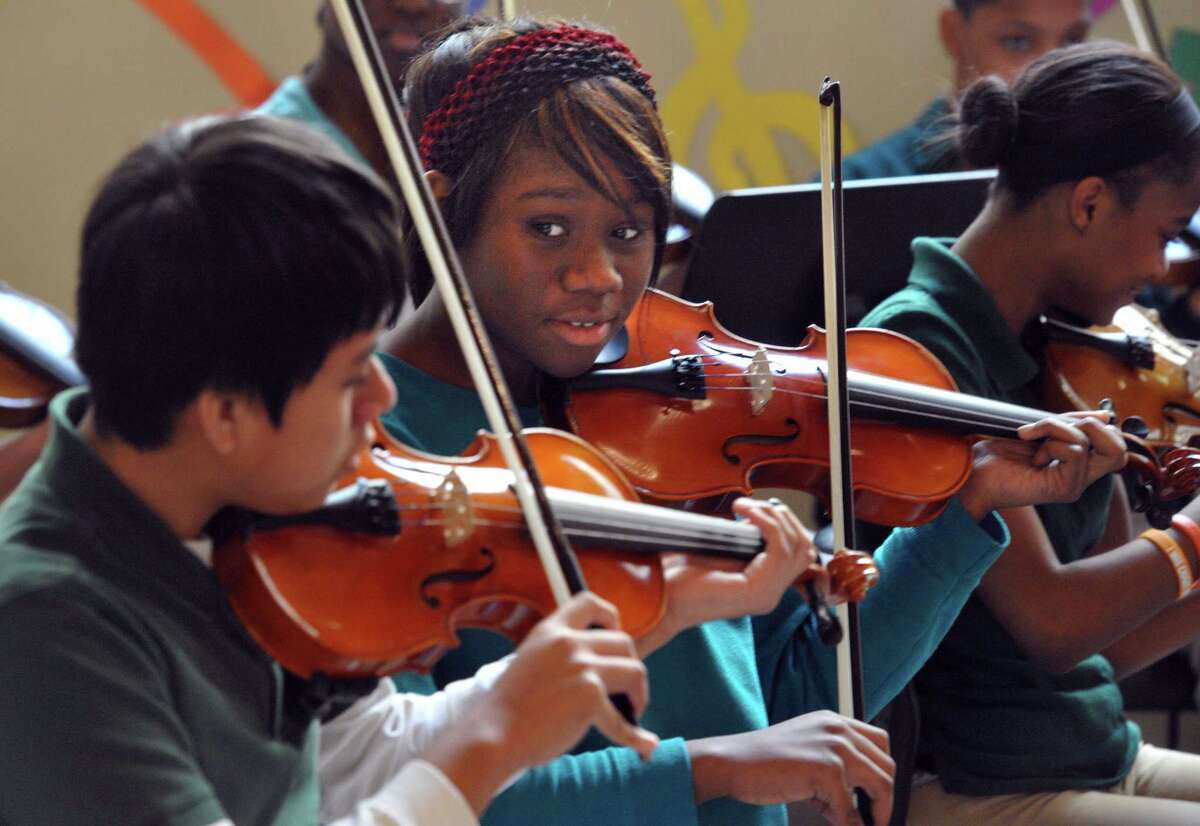 Photos of Augusta Lewis Troup Students with Donated Musical Instruments, New Haven