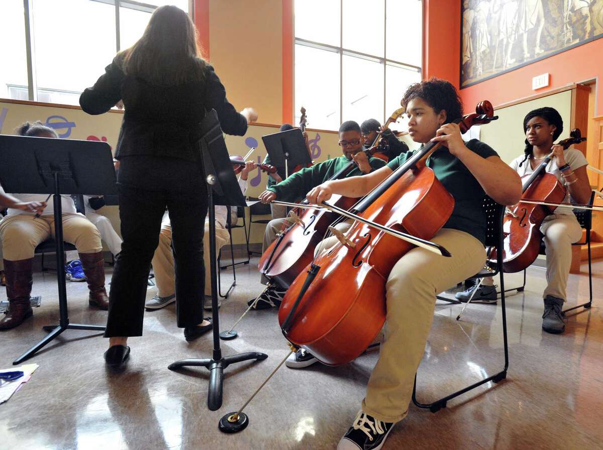 Photos of Augusta Lewis Troup Students with Donated Musical Instruments, New Haven