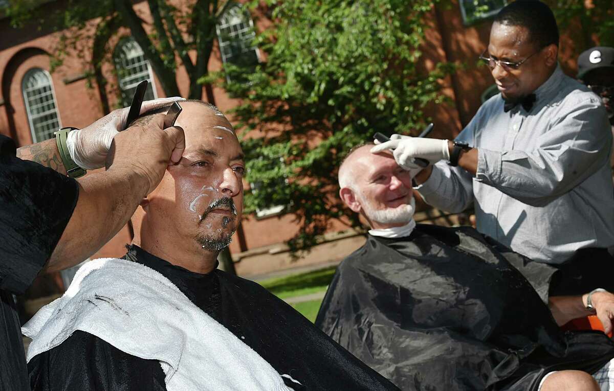 Free haircuts for homeless on New Haven Green bring smiles, new styles