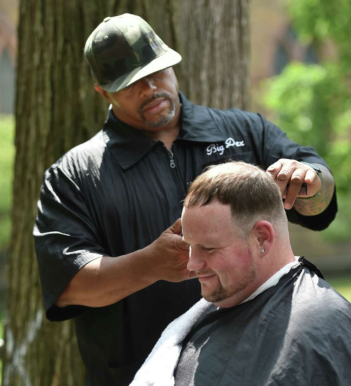 Free haircuts for homeless on New Haven Green bring smiles, new styles
