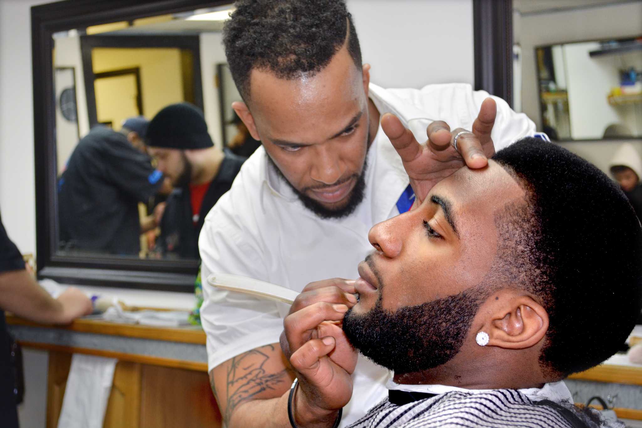PHOTOS: NBA star Andre Drummond delights fans at Middletown barber shop
