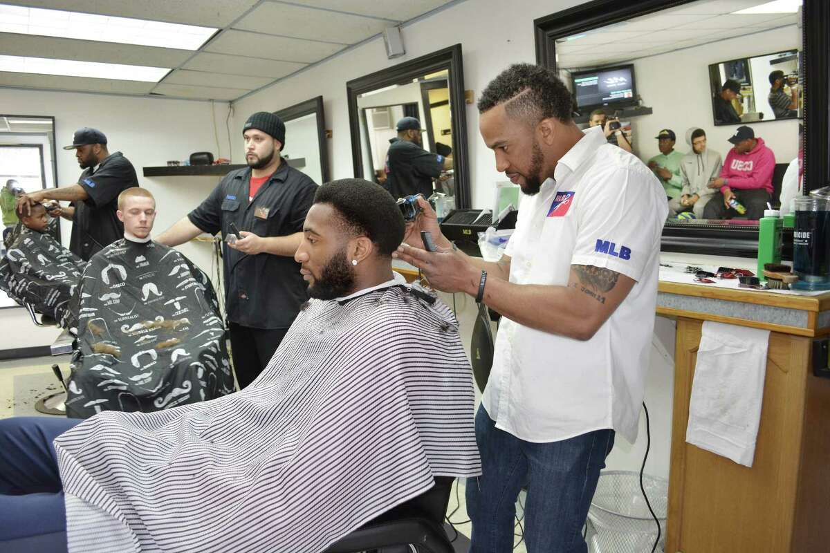 PHOTOS: NBA star Andre Drummond delights fans at Middletown barber shop