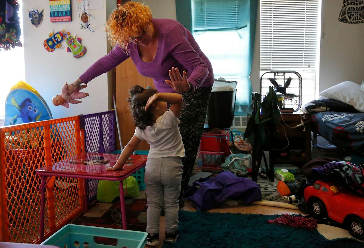 Mom panhandling with newborn sparks polarized debate