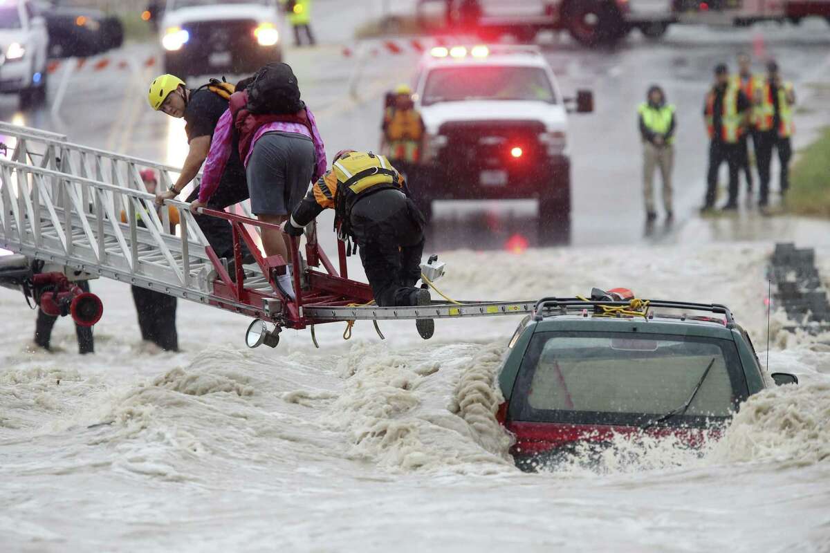 Record-breaking rainfall prompts rescues, evacuations