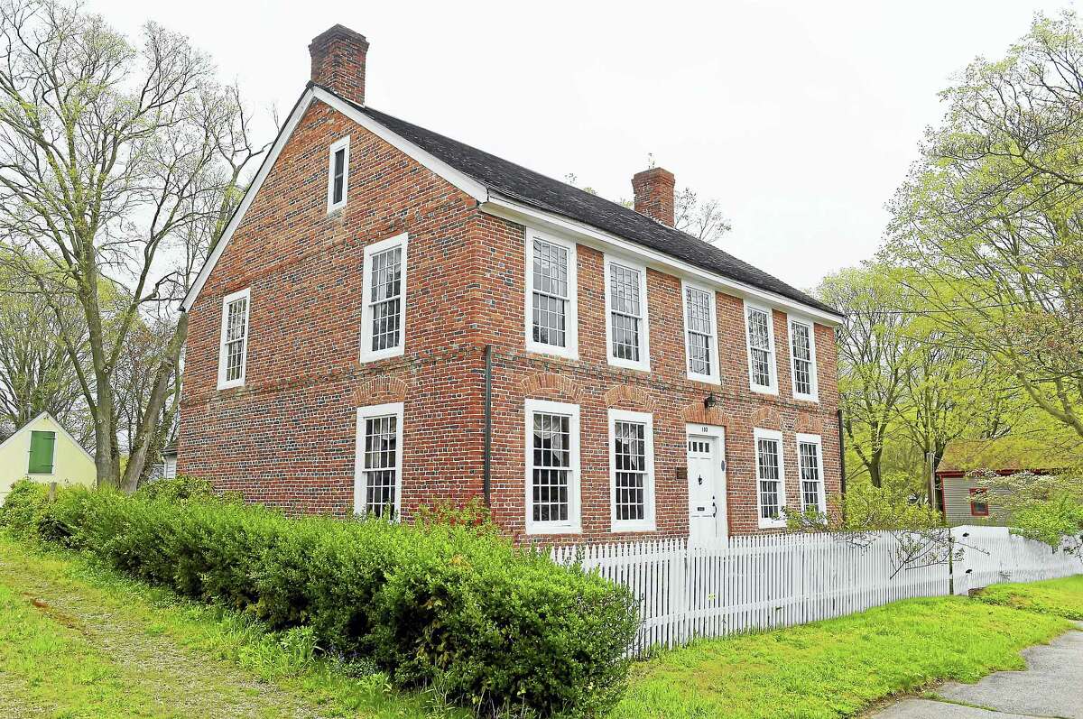Master stone artisan rebuilds old smokehouse behind ‘Old Brick’ in Clinton