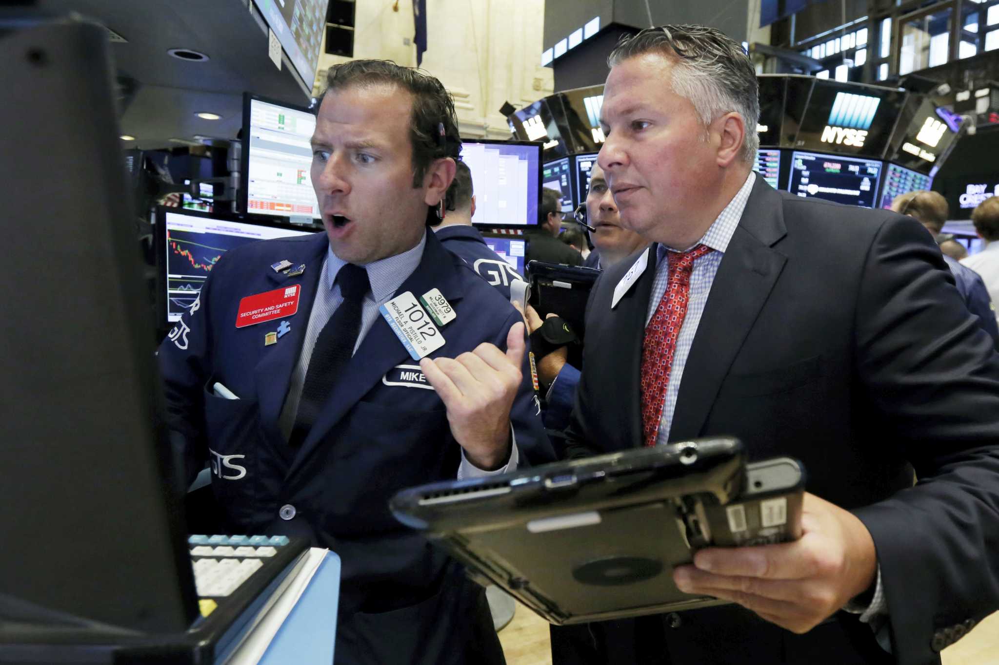 Stocks eke out late gains to hit more records