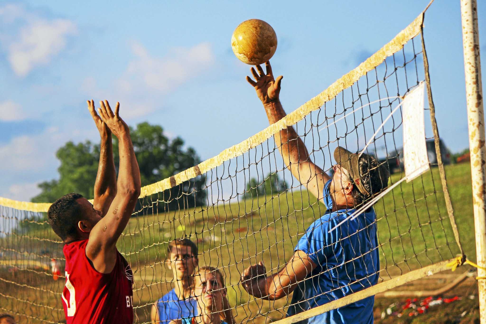 Mud volleyball players slog through mire for Epilepsy Foundation in ...
