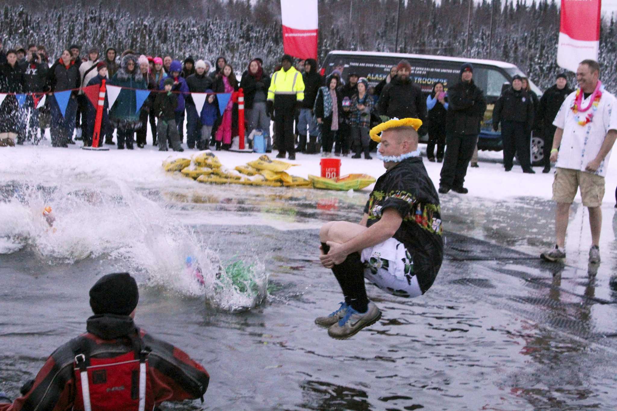 Alaskans make annual plunge into frigid lake for good cause