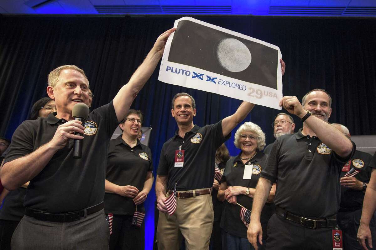 NASA’s New Horizons spacecraft achieves Pluto flyby, then calls home