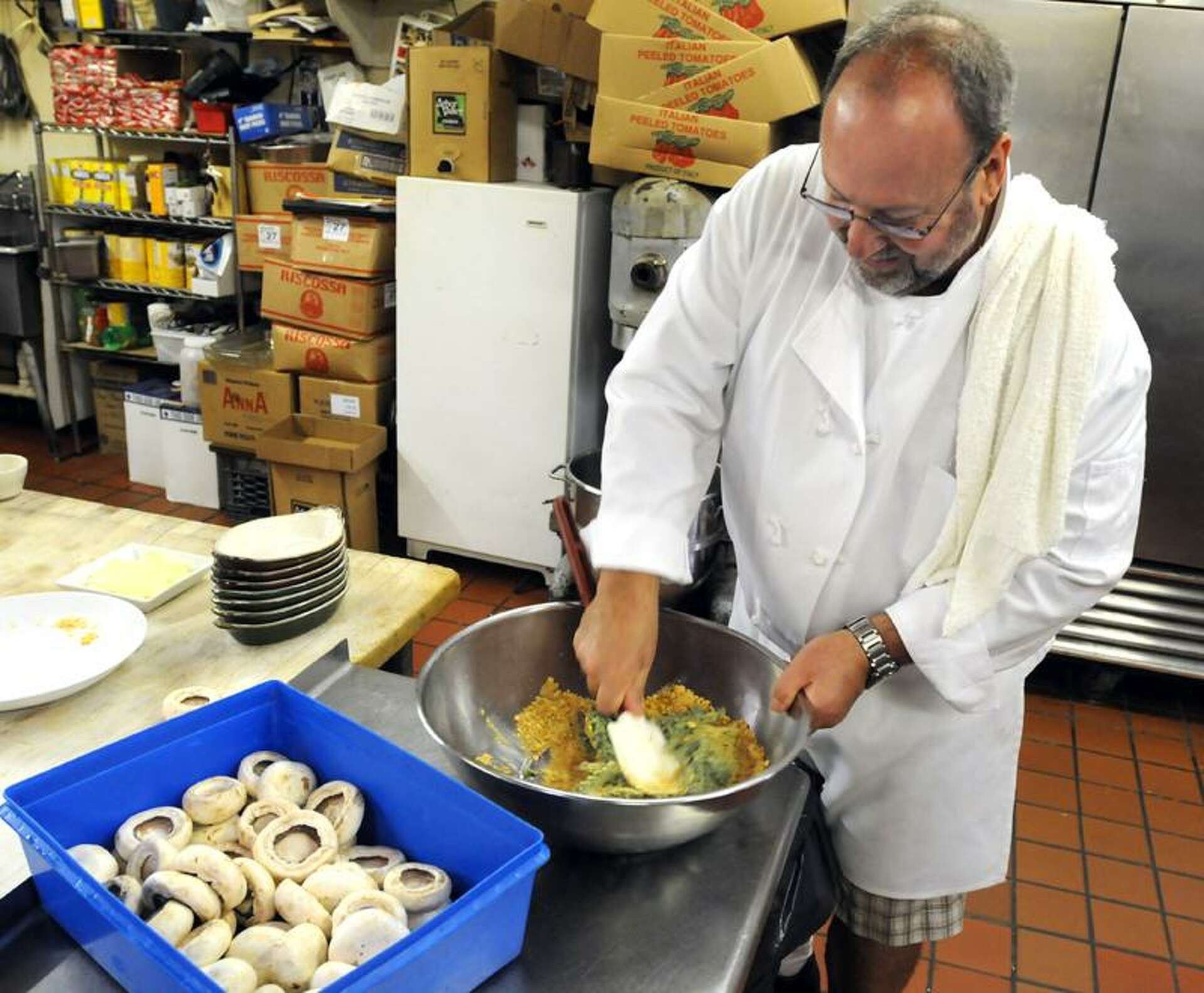 Chef Russ Keith makes the stuffed mushrooms at the Log Cabin in Clinton ...