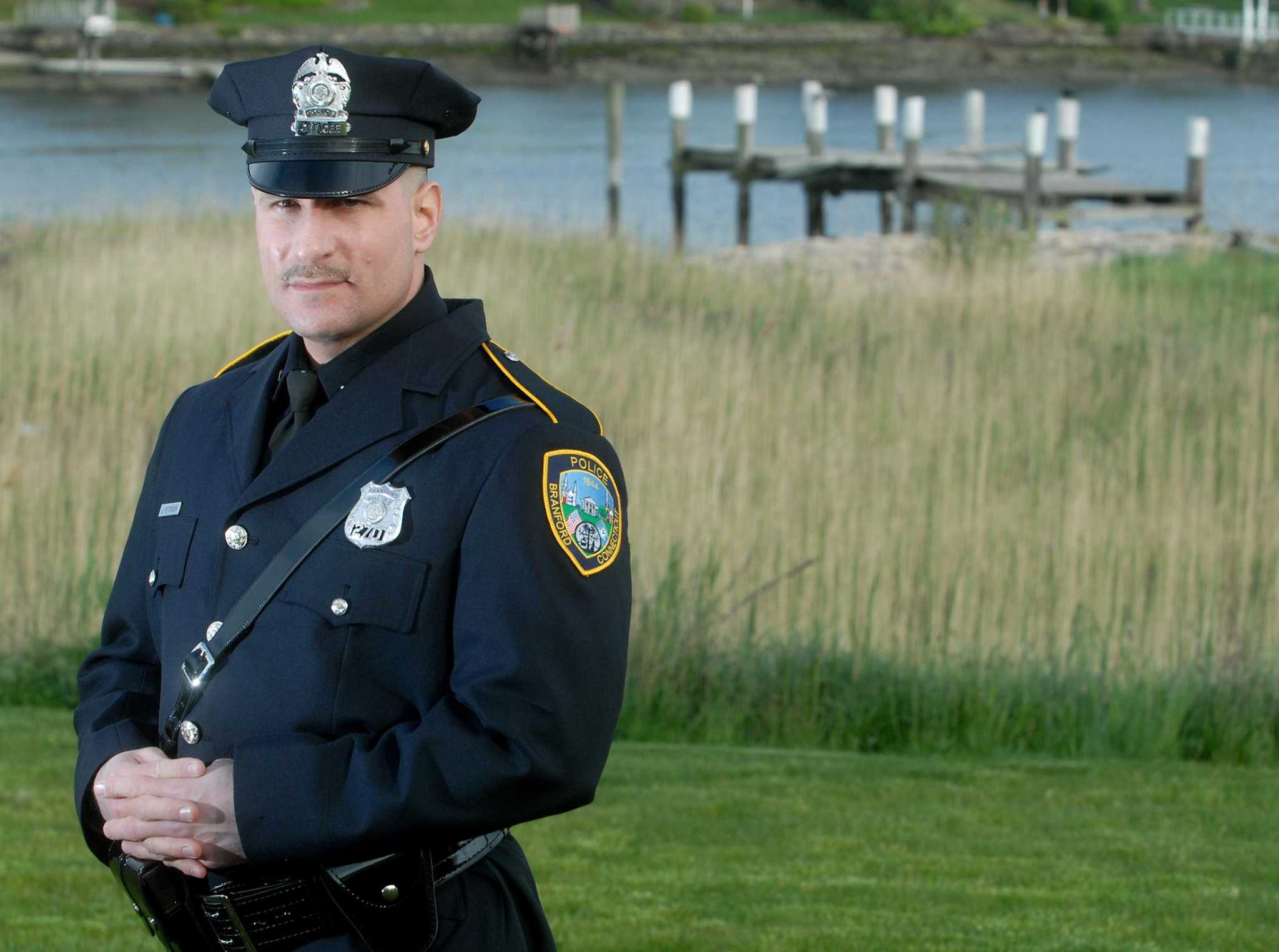 Officer who apprehended Branford slaying suspect honored for past heroics