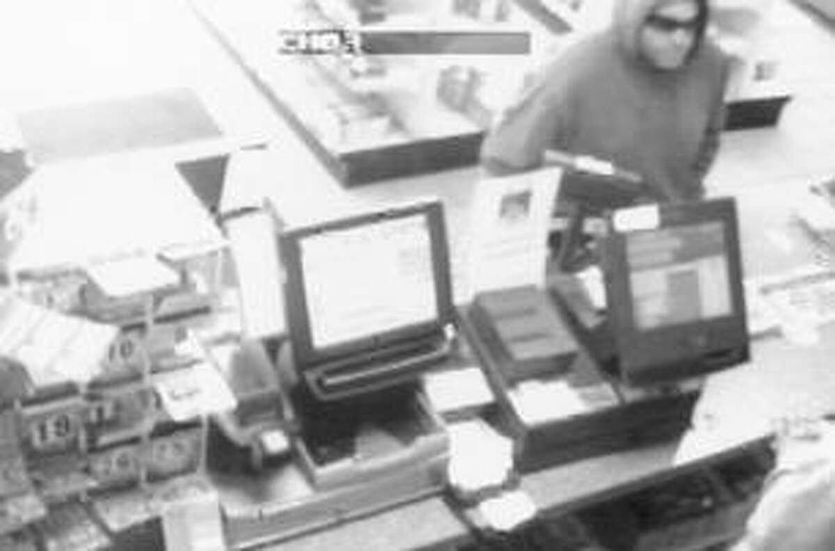 Cops Robber Implies Weapon During Gas Station Hold Up