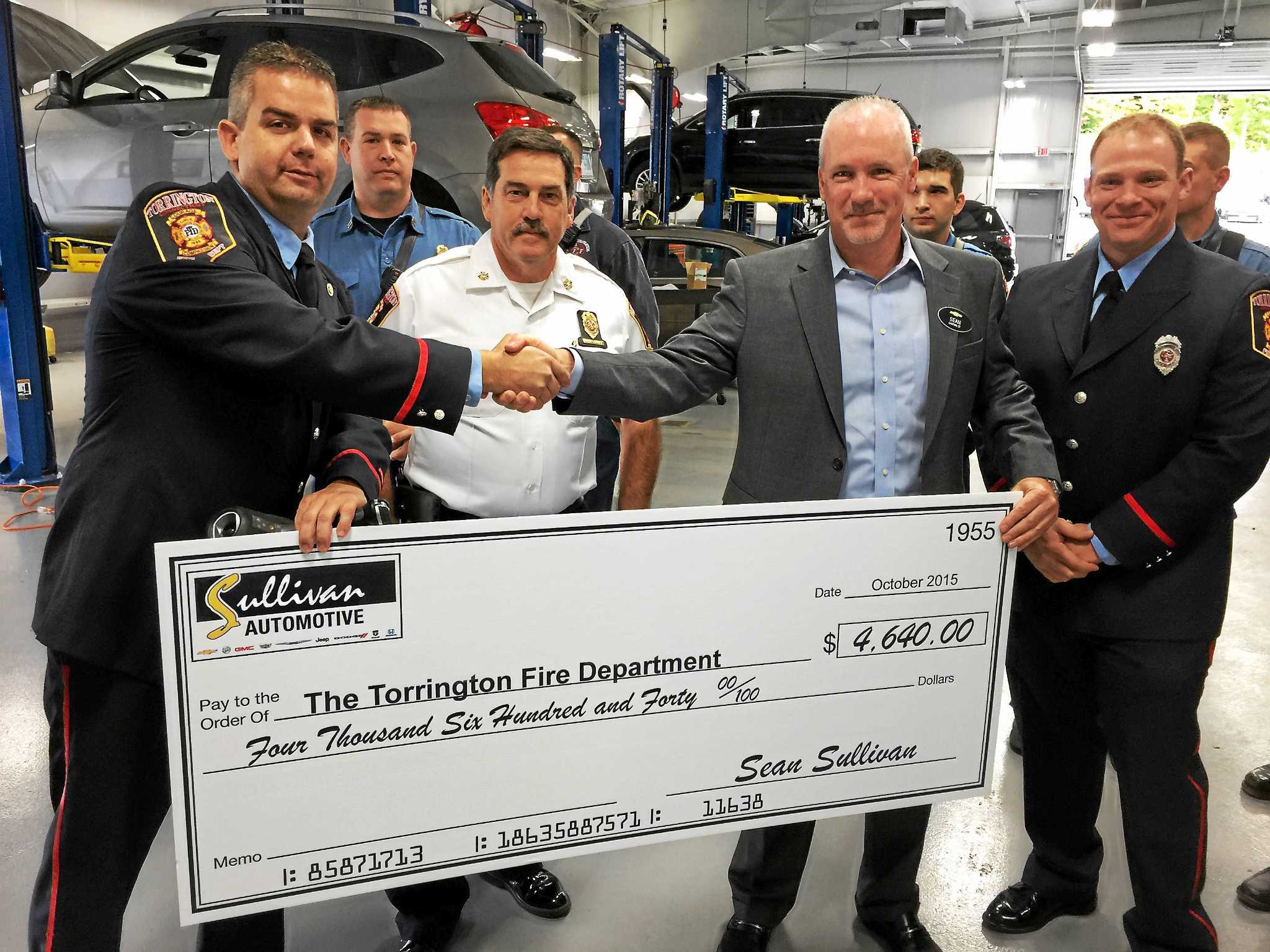 Local dealership thanks Torrington Fire Department with donation