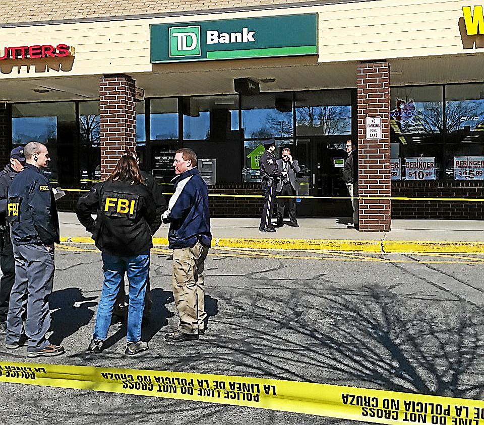 Torrington bank robbery suspect in custody after chase, crash