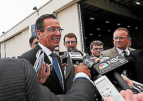 Malloy tries to stay above the fray while denying accusations