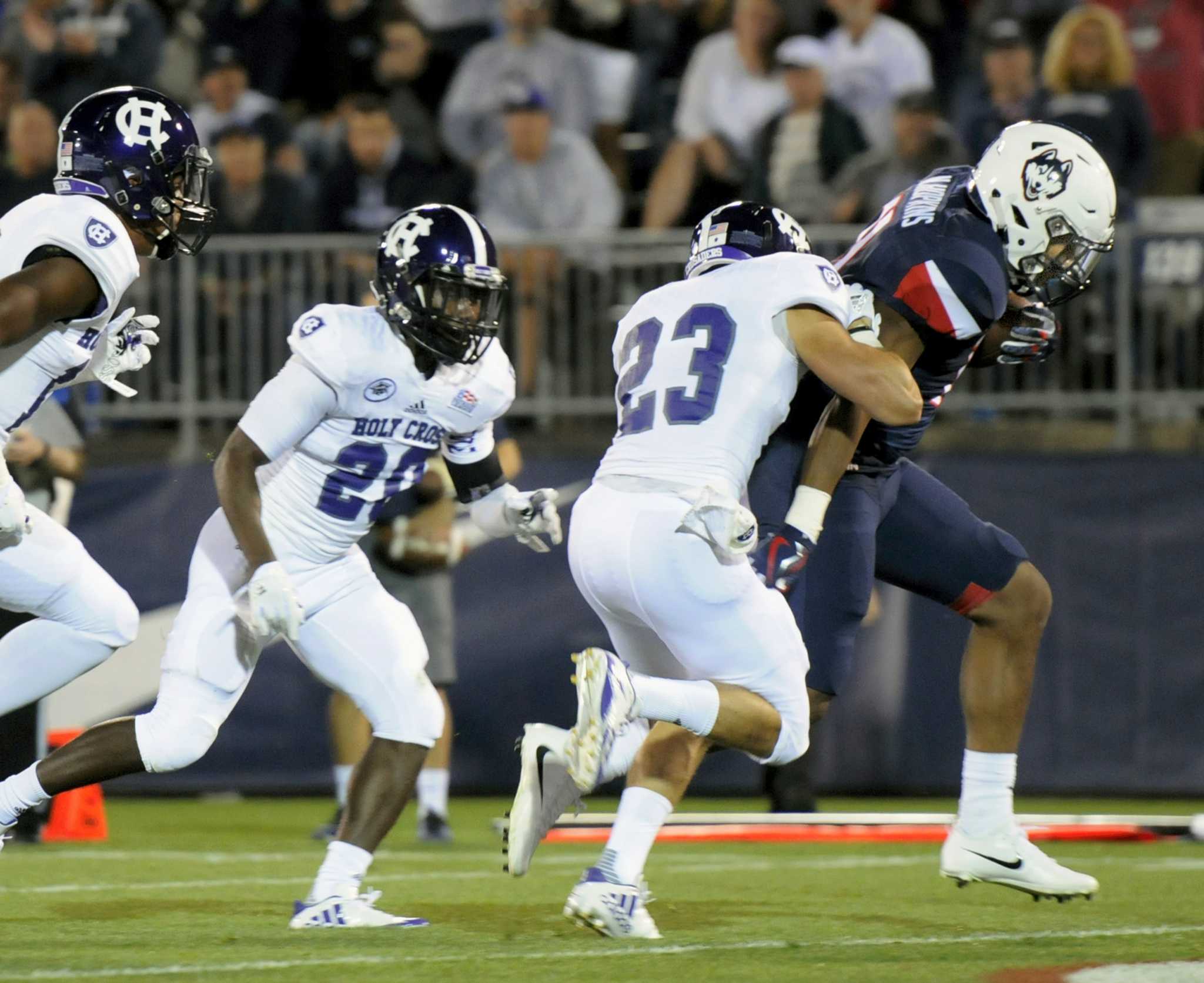 UConn football team comes from behind to beat Holy Cross
