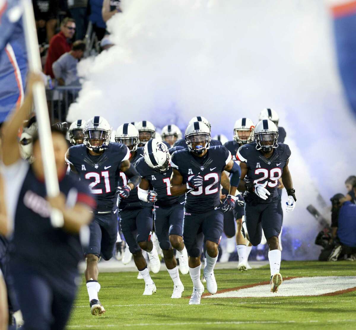 UConn football team comes from behind to beat Holy Cross