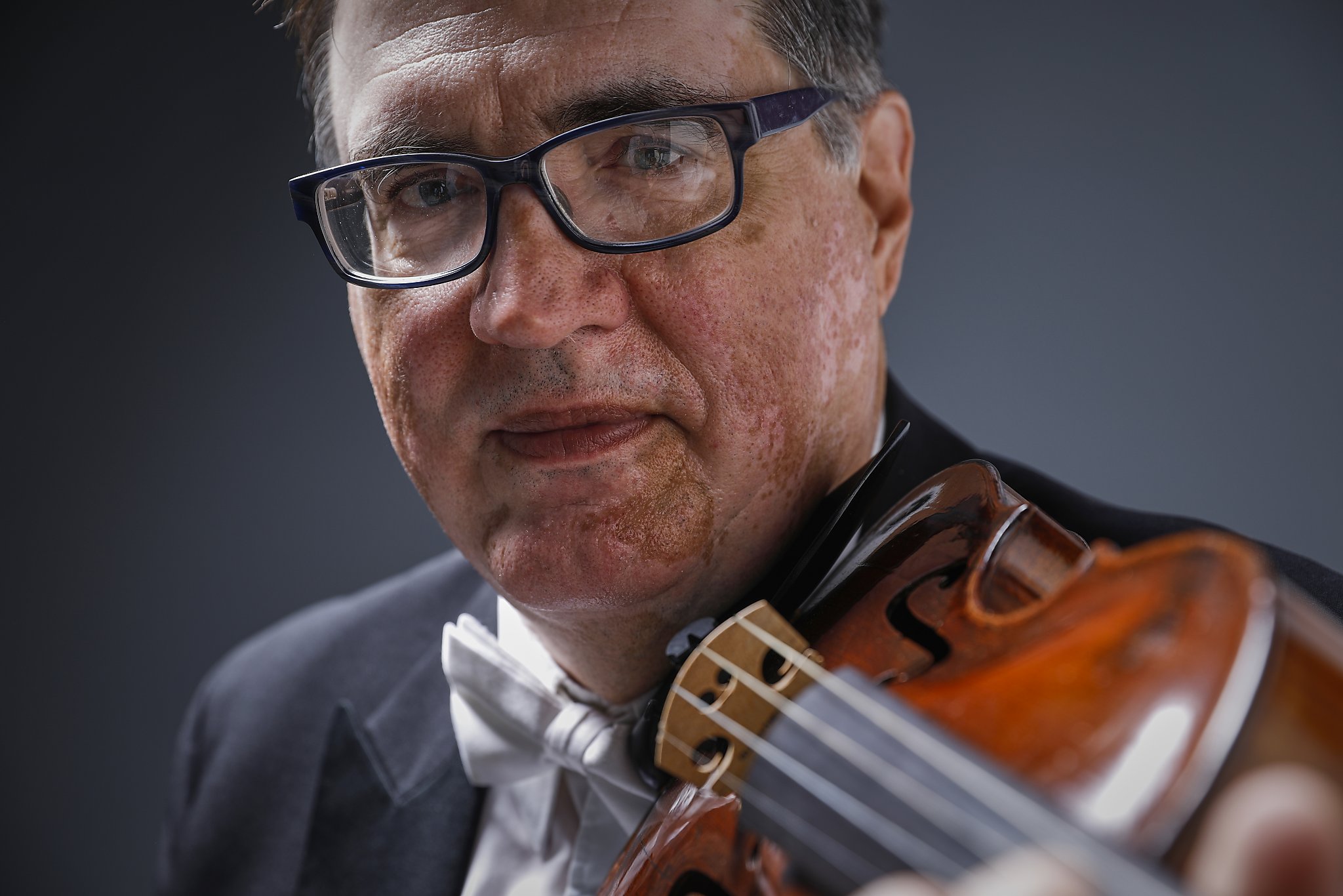 Violinist Mark Volkert, a stalwart of the Symphony, is bowing out