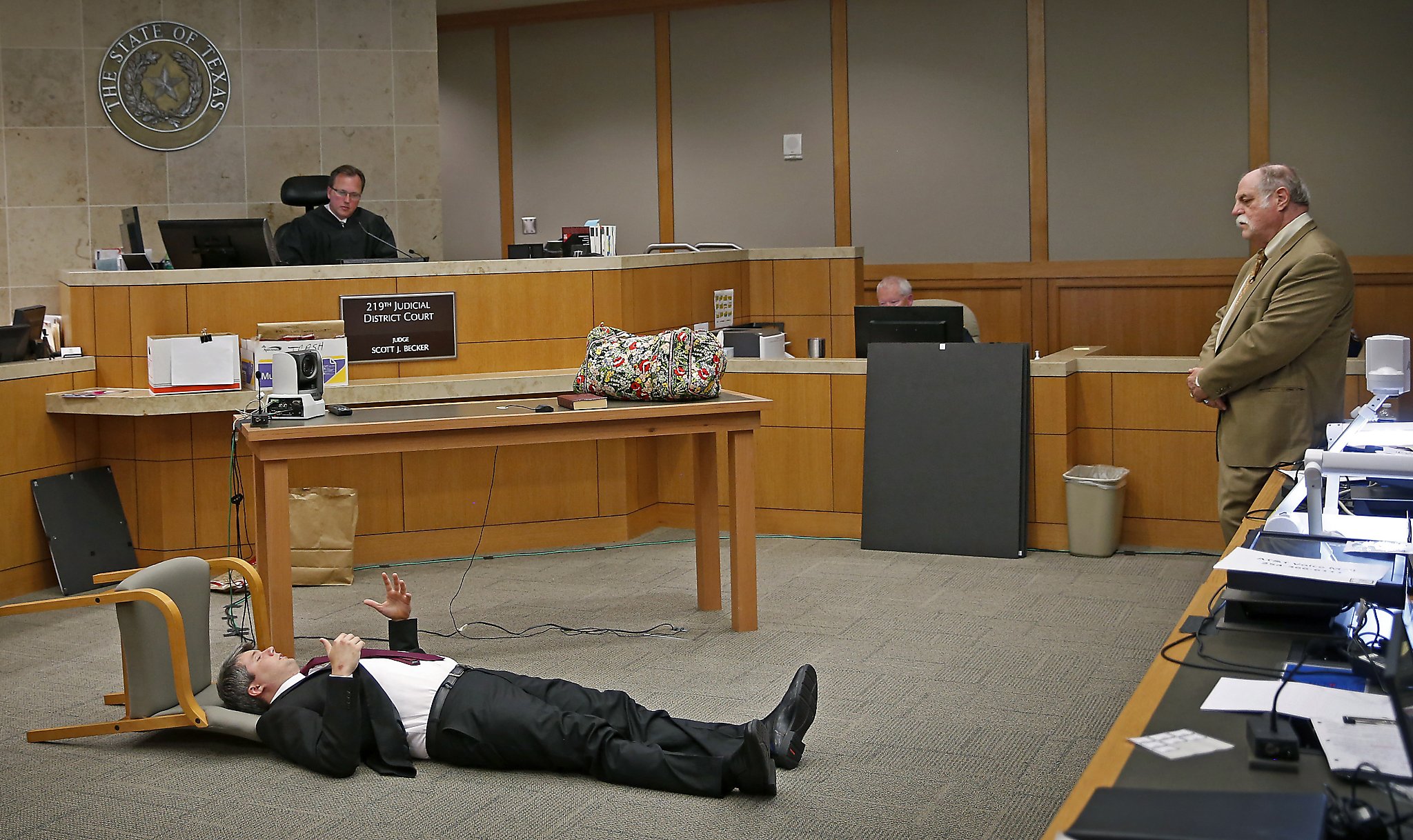 Texas man on trial for murder reenacts for the jury how he found ...