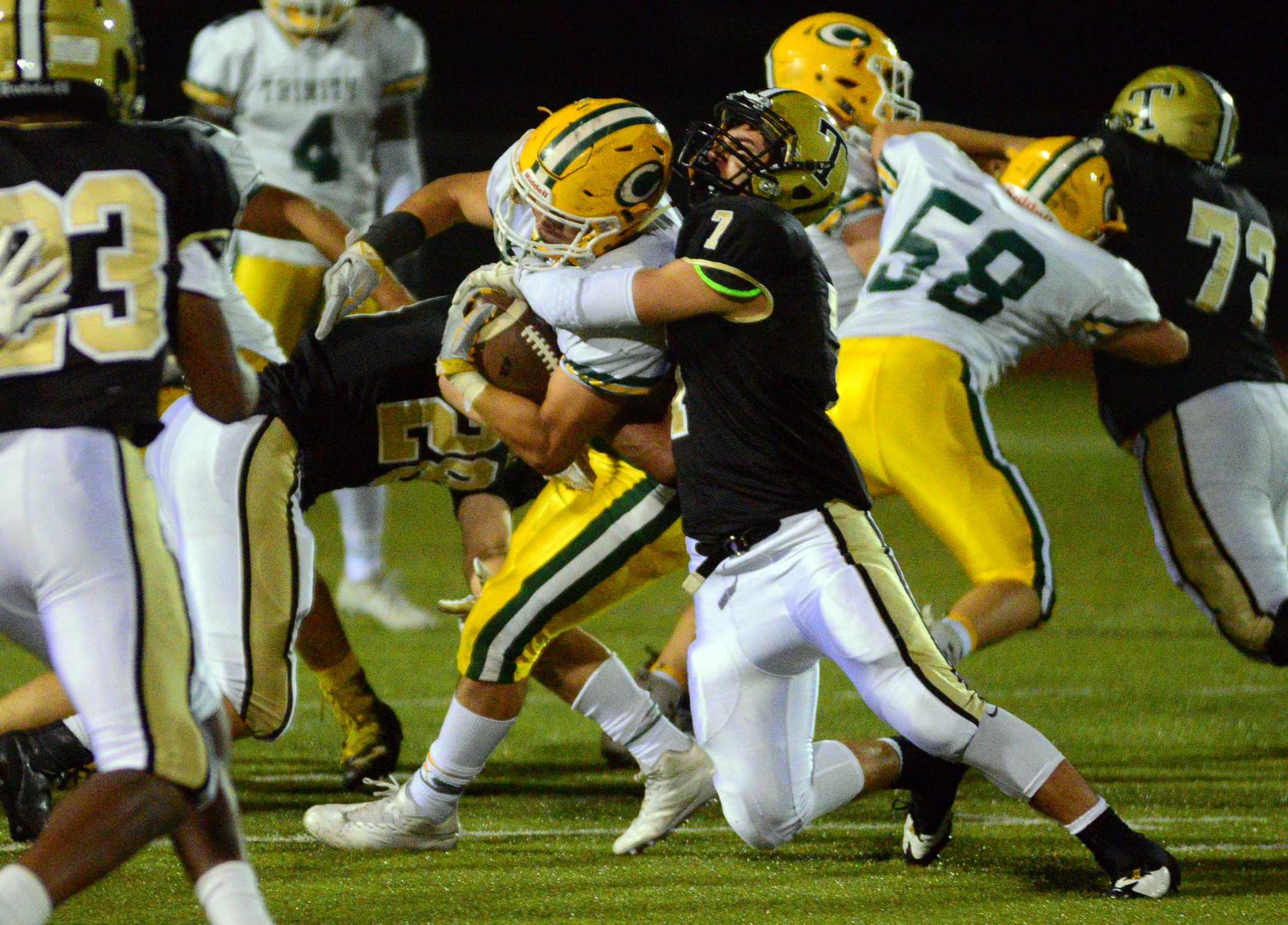 Trumbull football holds off Trinity Catholic