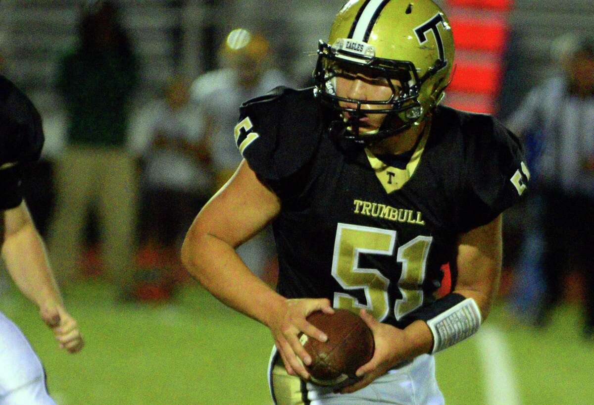 Trumbull football holds off Trinity Catholic