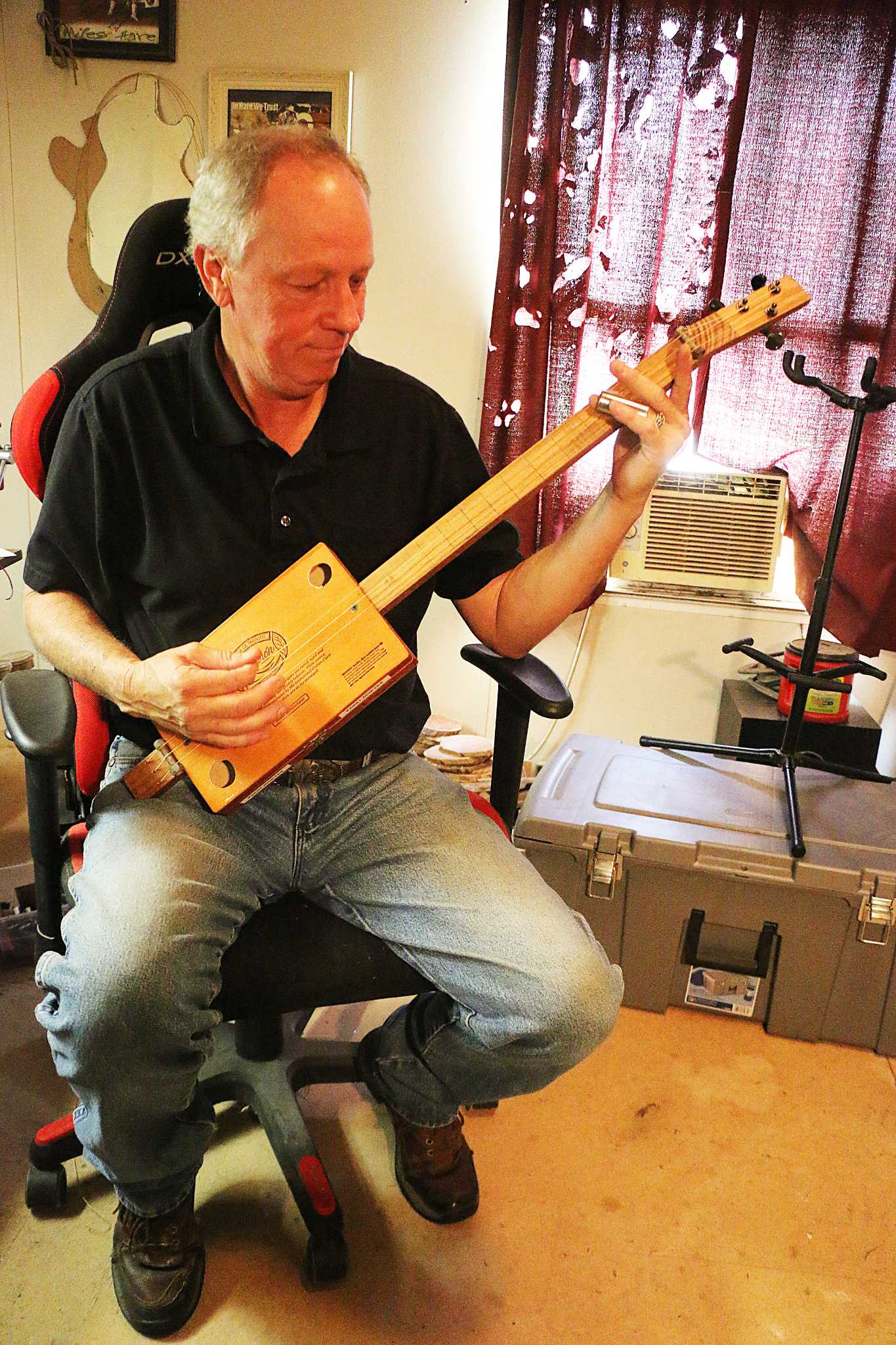 Devers man making music with some odd-looking instruments