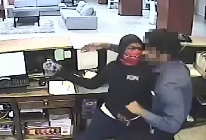 Video: Police search for suspects in hotel assault and robbery