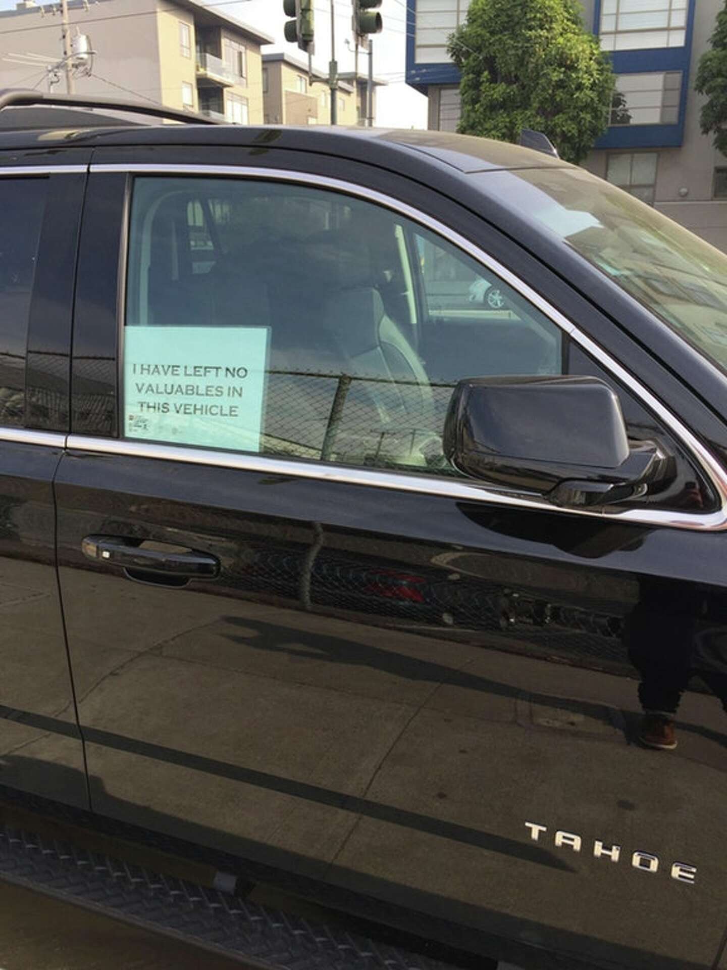 Does placing a 'no valuables inside' sign in a car window deter break-ins?