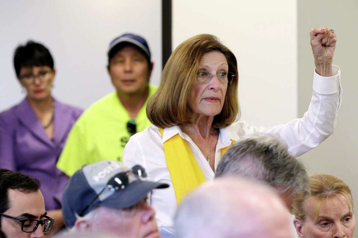 Angry residents rally to confront MUD board