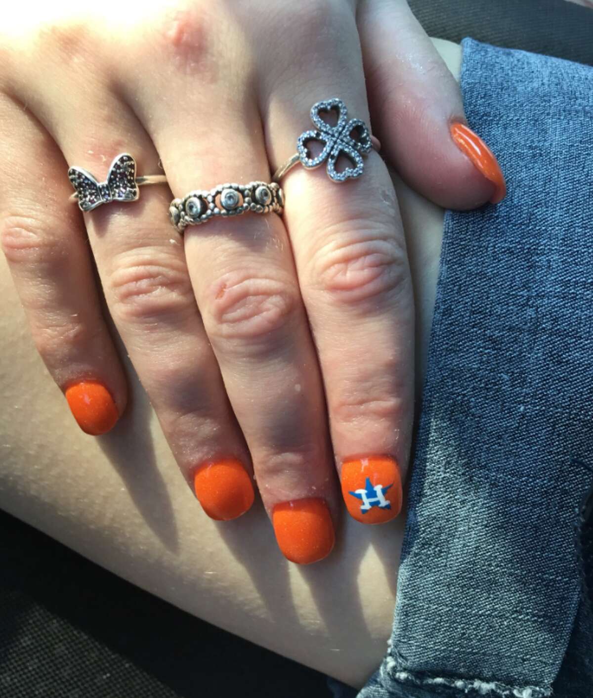 Houston Astros fans and nail artists are painting the town orange and blue