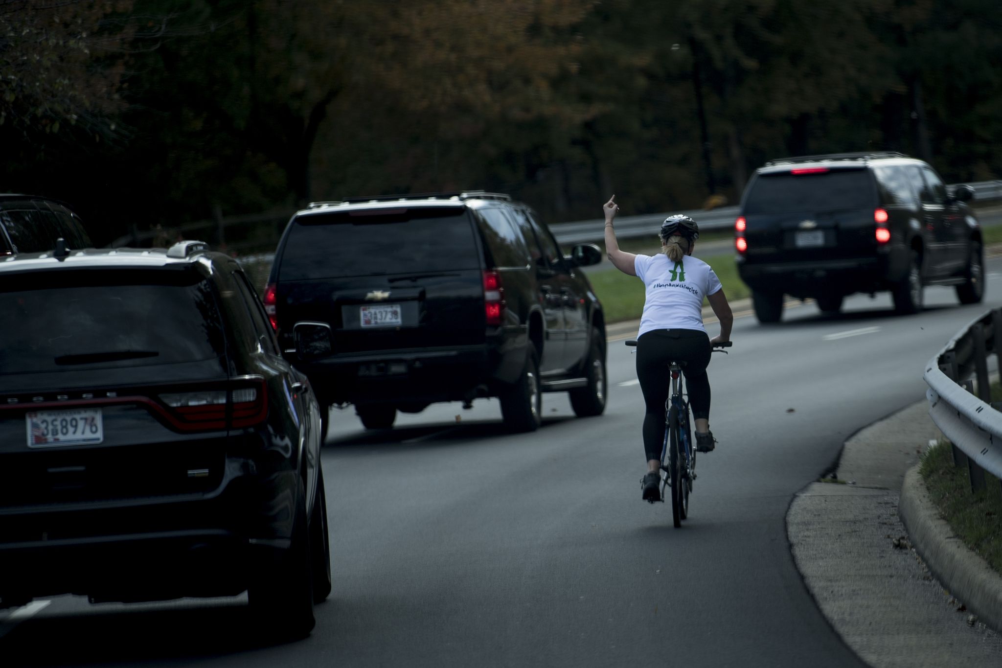Cyclist greets Trump's motorcade with middle finger (twice) as it ...