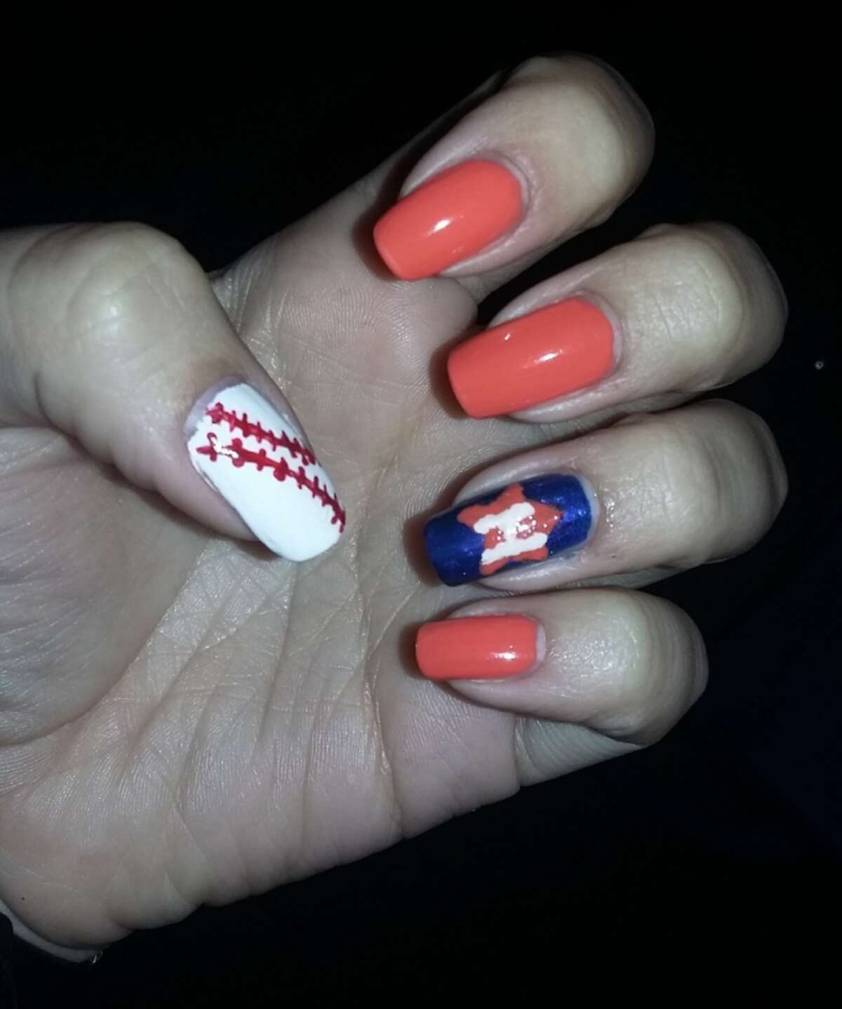 Houston Astros fans and nail artists are painting the town orange and blue