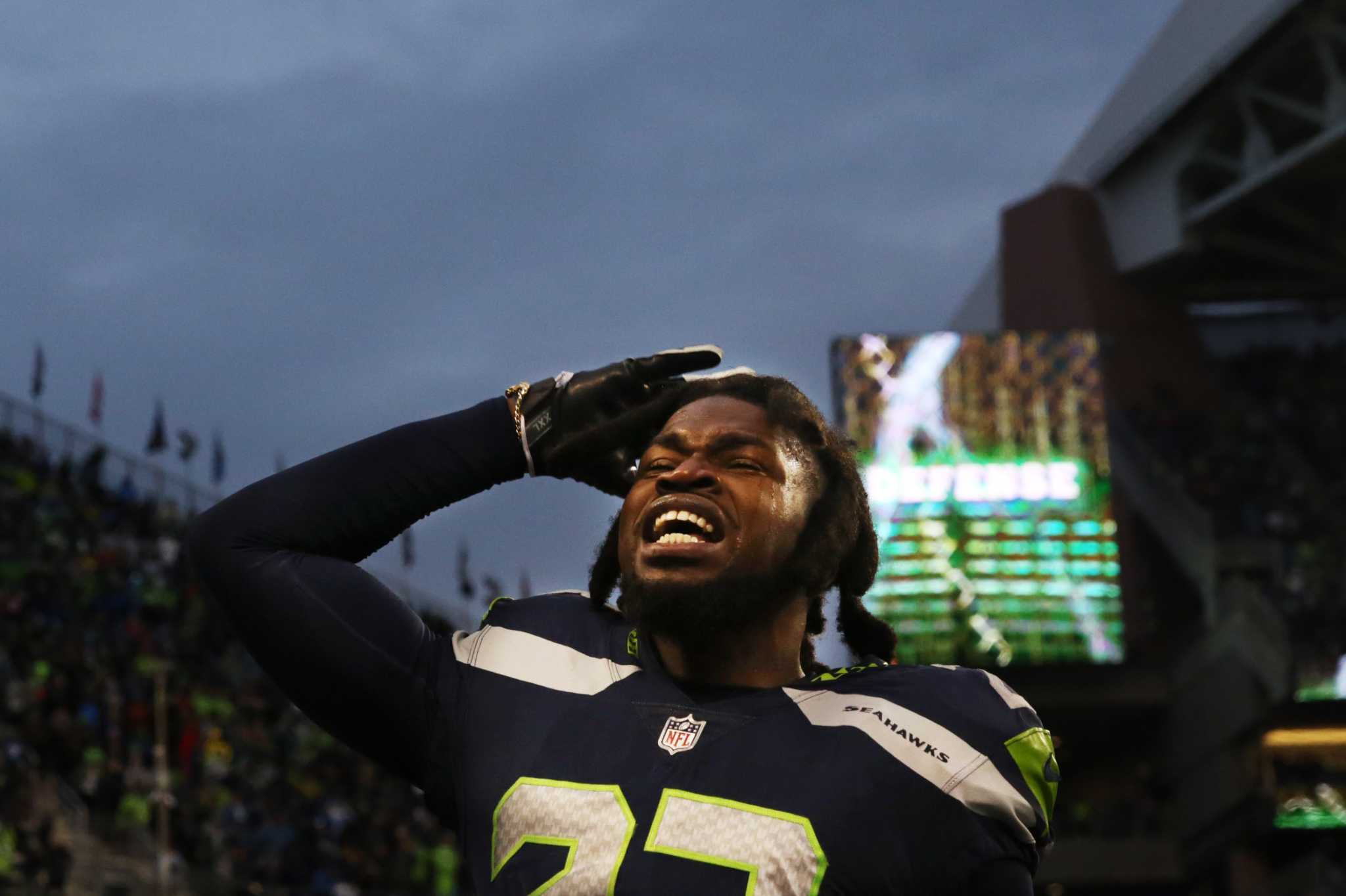 Video shows woman berating Seahawks players over anthem protest