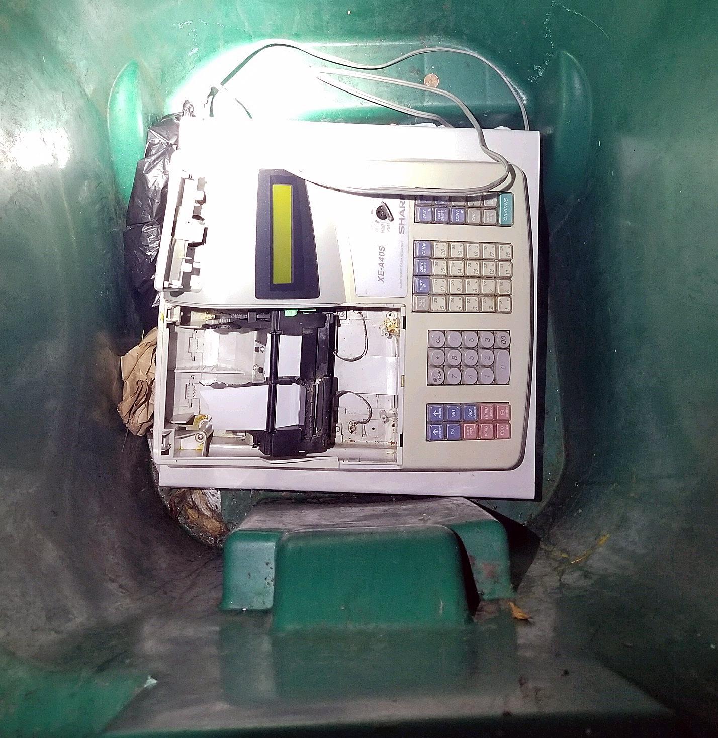 Man uses recycling bin to tote stolen cash register