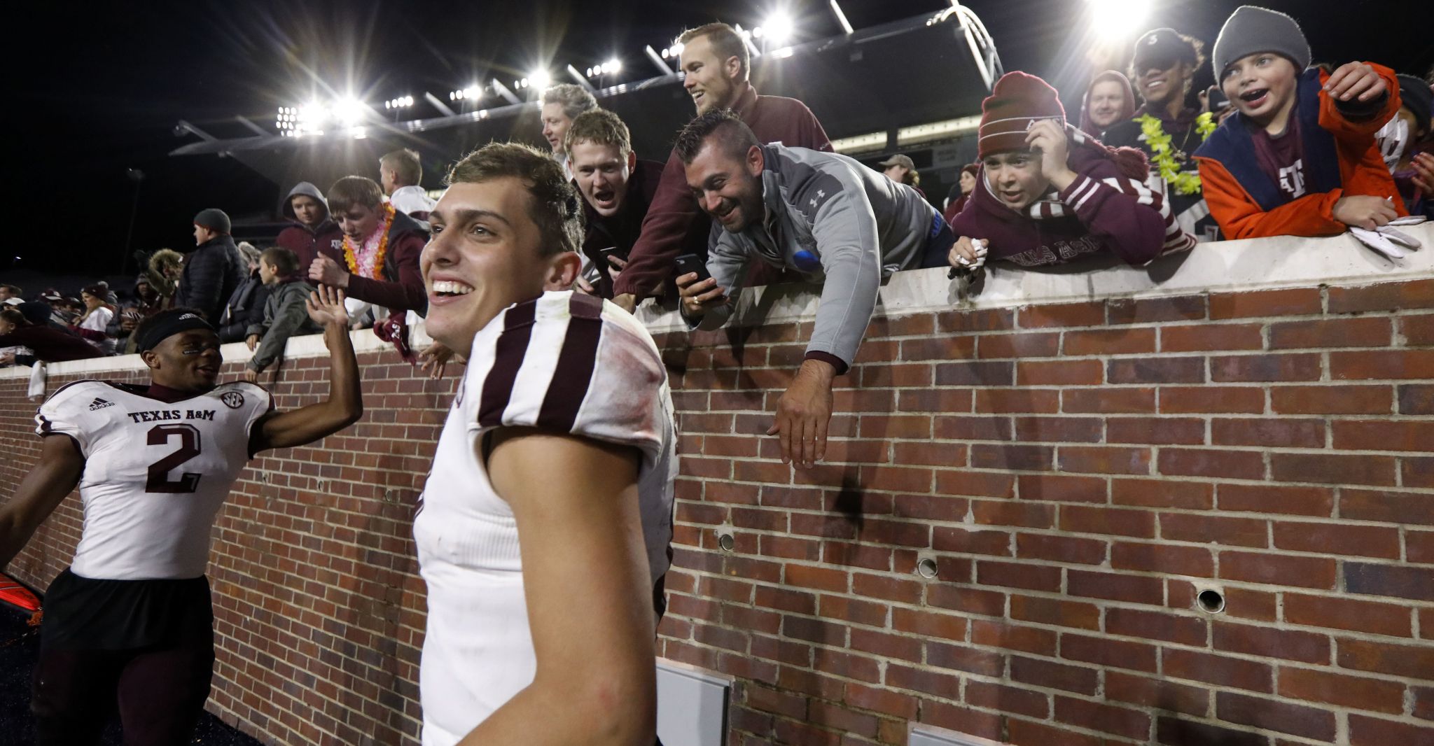 Troop of Aggies fans help team celebrate win in Mississippi