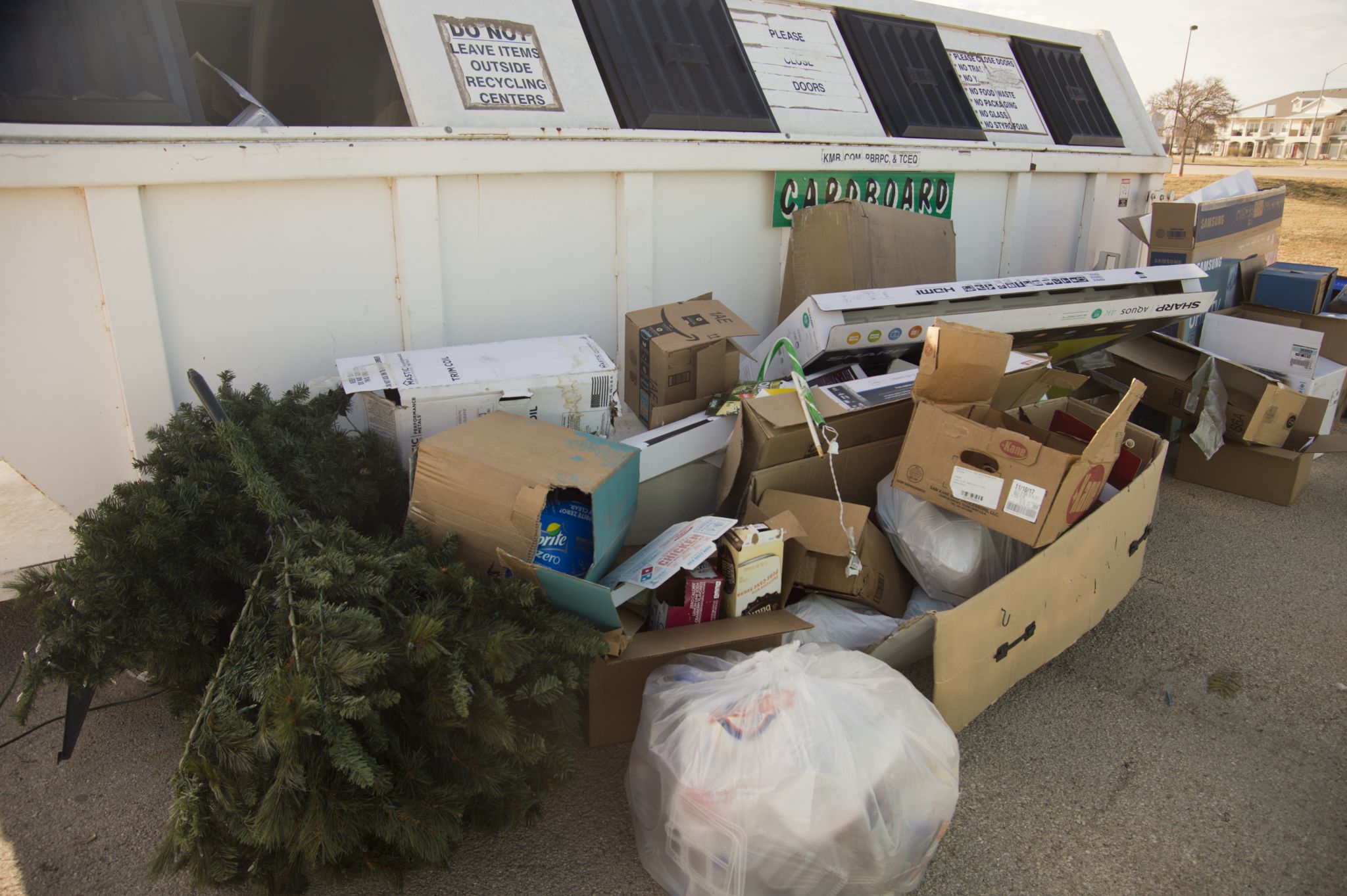 Recycled items, trash left outside bins