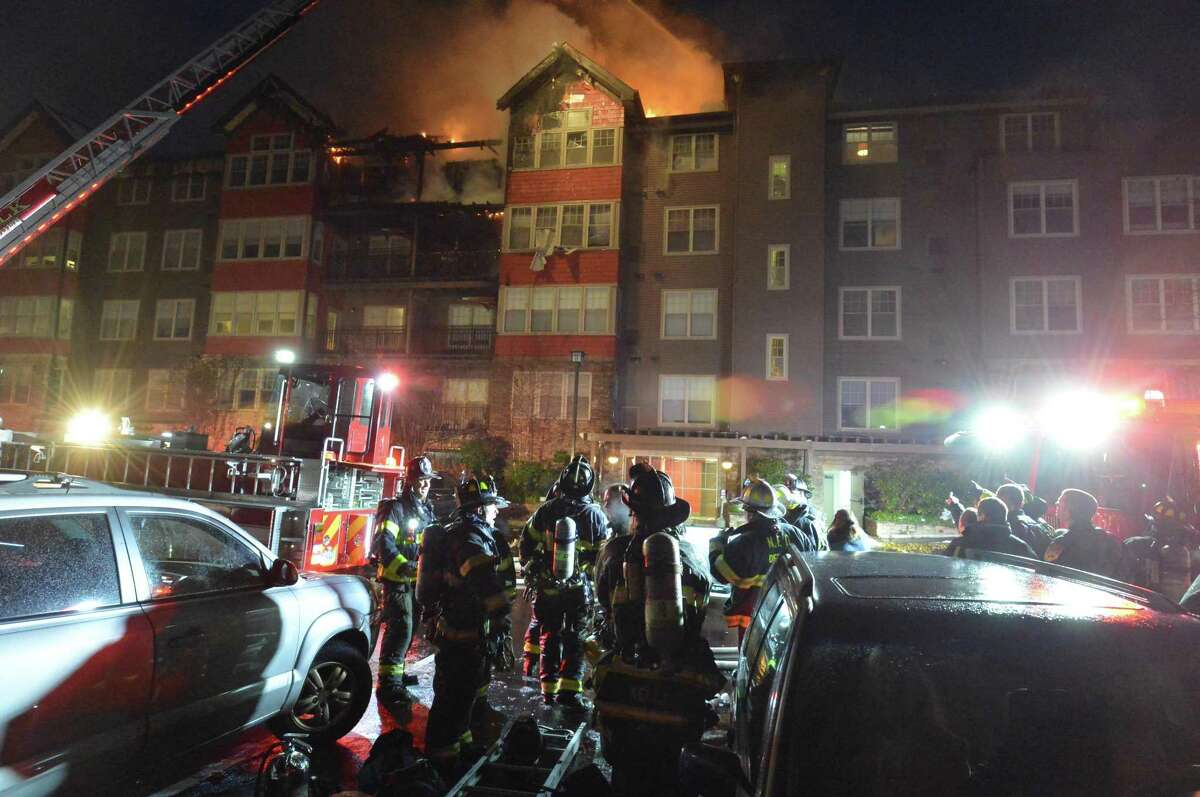 Flames tear through four-story Norwalk condo complex