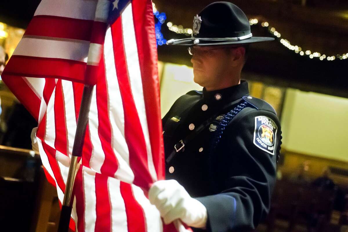 Midland Police Honor Guard present colors at Project Blue Light in Bay City