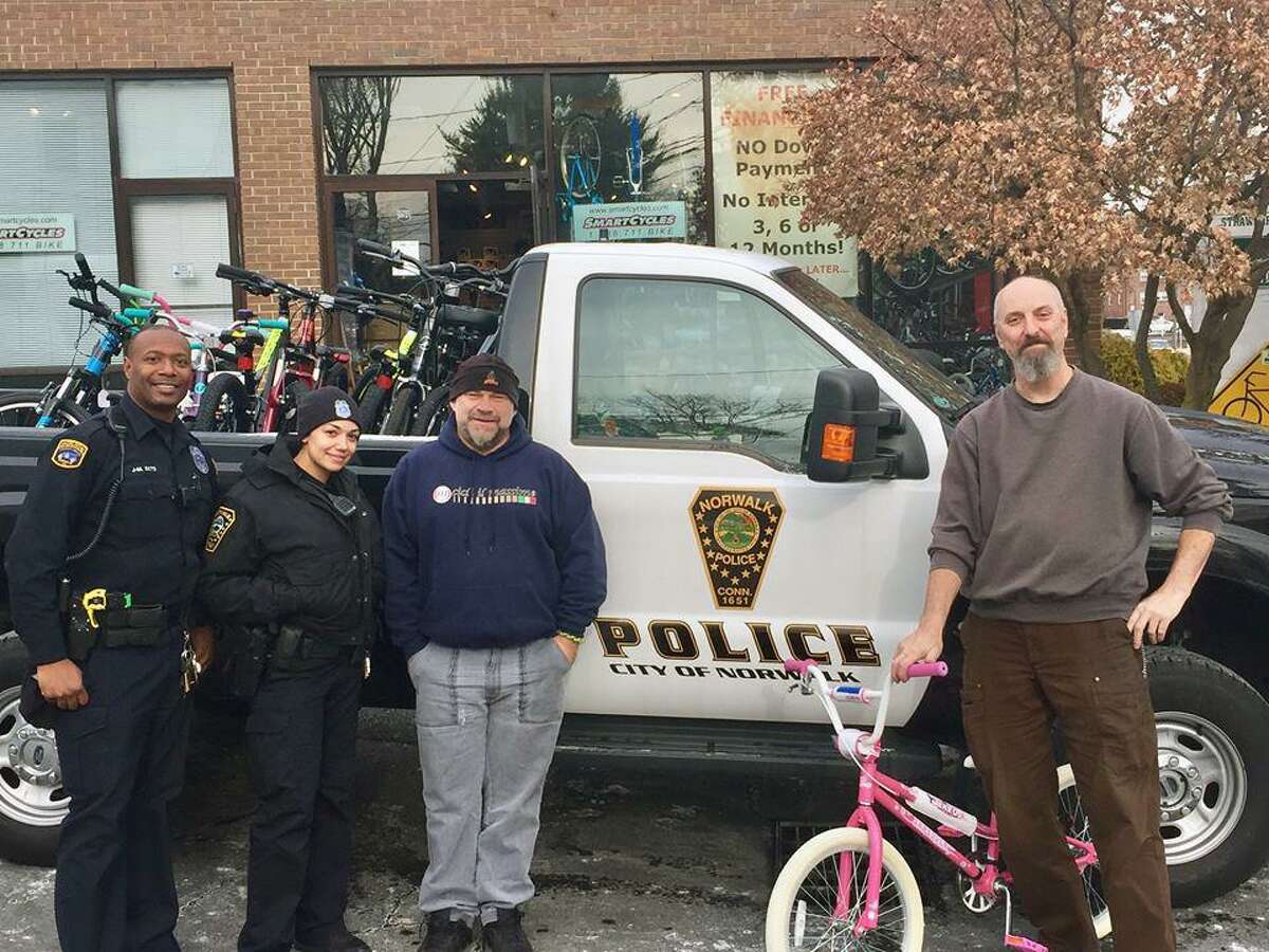 Norwalk police deliver toys, bicycles