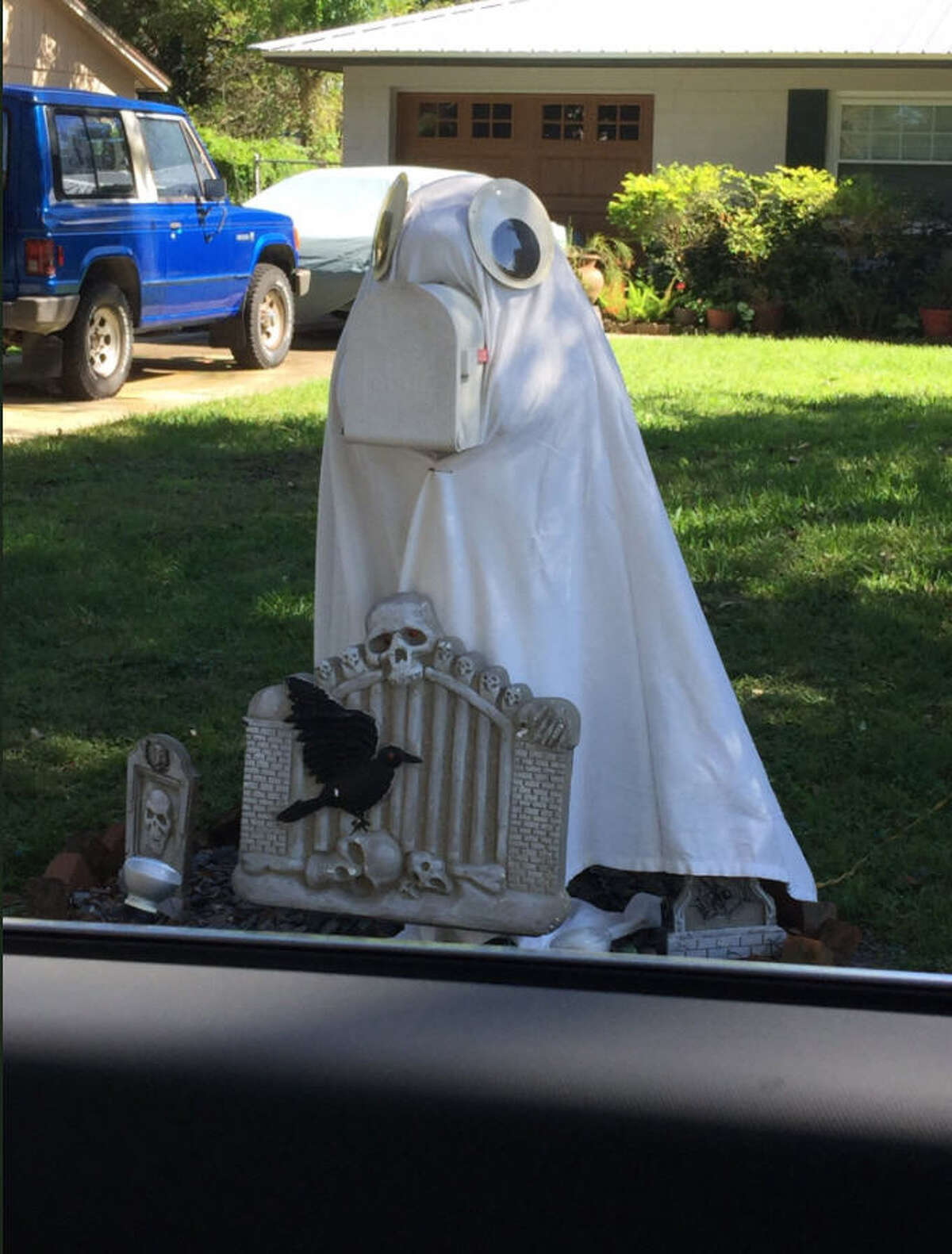 Florida family dresses up manatee-shaped mailbox for the holidays