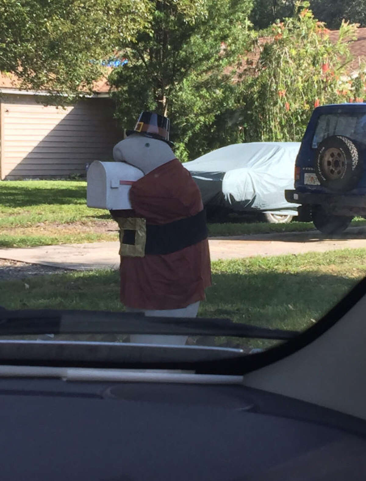 Florida family dresses up manatee-shaped mailbox for the holidays