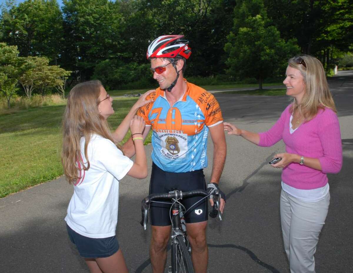 After cross-country journey, cyclists welcomed back to Greenwich