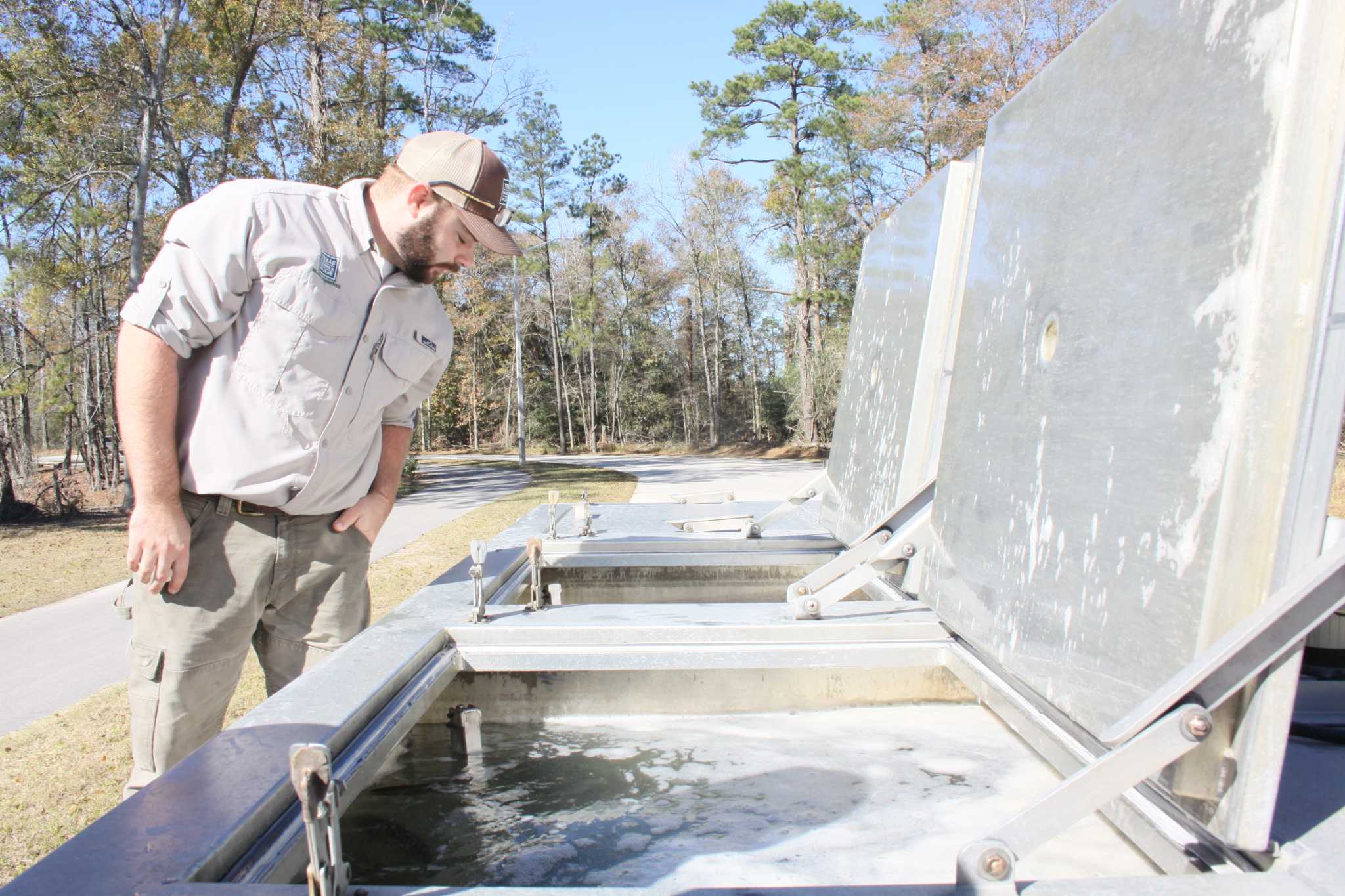 Annual pond restocking sets loose seasonal fish in northwest Houston parks
