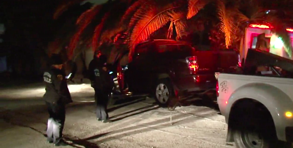 Police trying to determine how man got pinned to wall by own vehicle