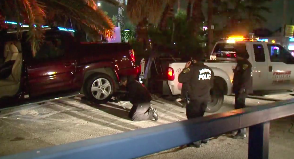 Police trying to determine how man got pinned to wall by own vehicle