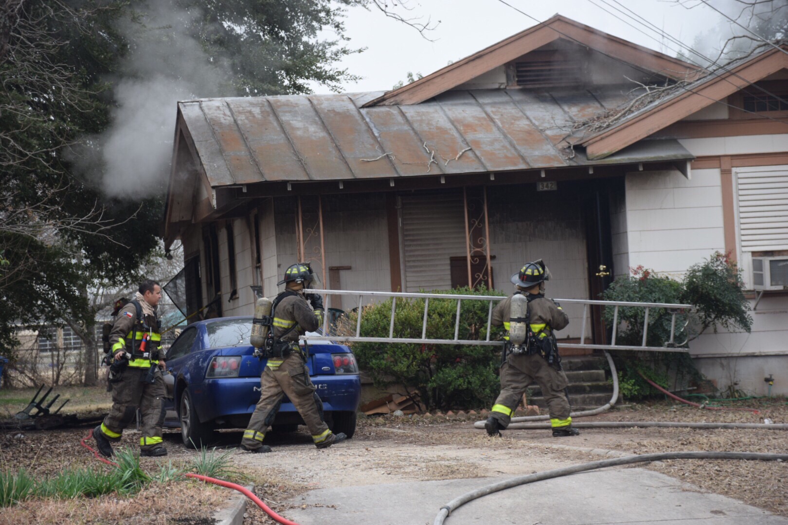 Heavy smoke pours from East Side home as firefighters rush to battle blaze