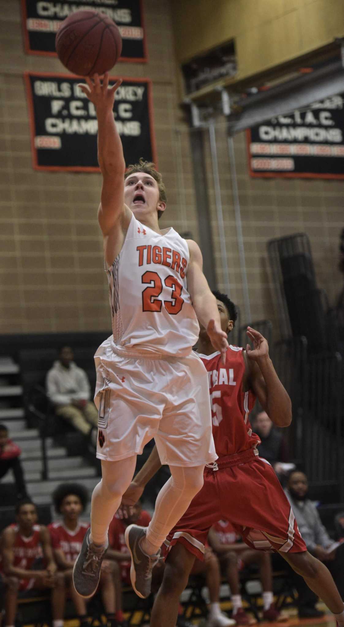 Boys basketball: Ridgefield pulls away from Central late